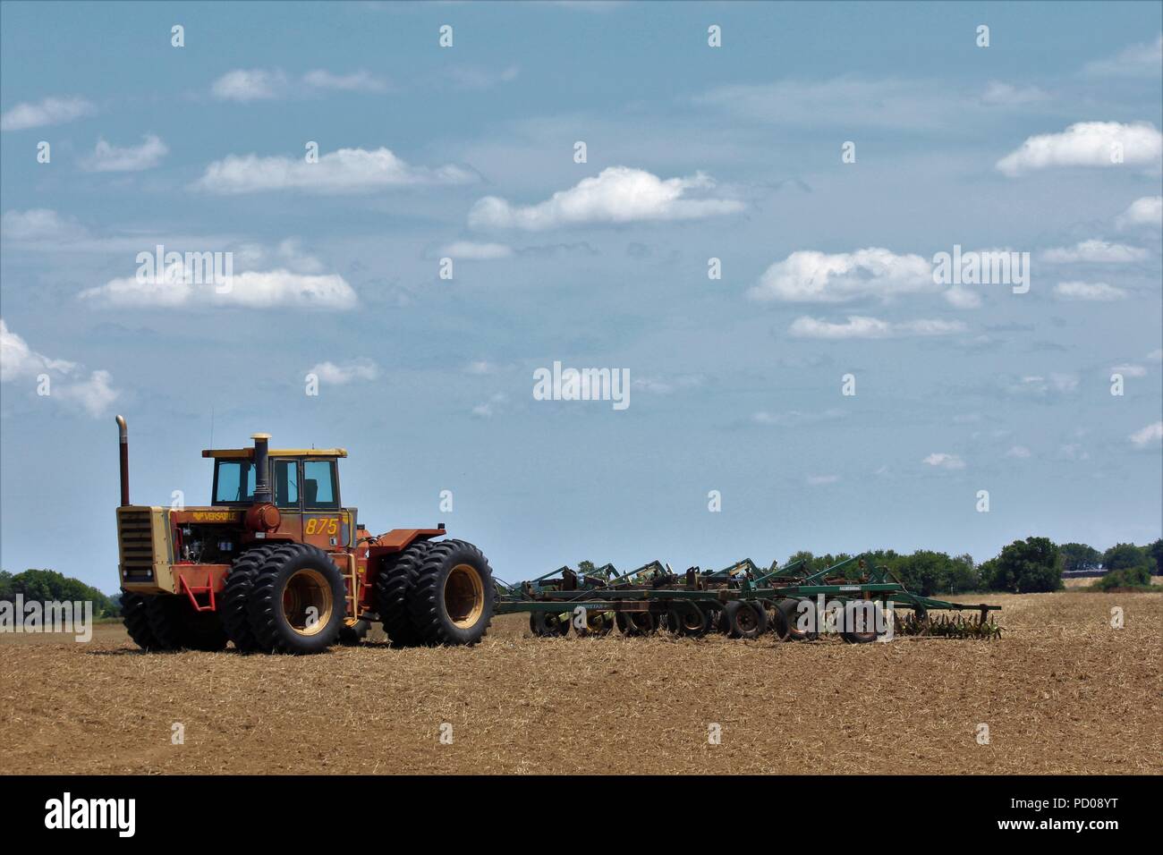 Tractor with harrow on a field hi-res stock photography and images - Alamy