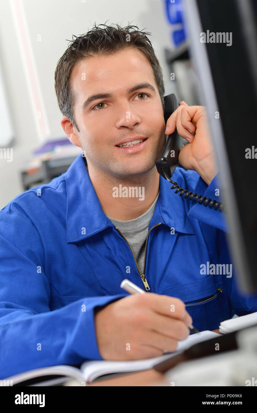 Writing something during a call Stock Photo - Alamy