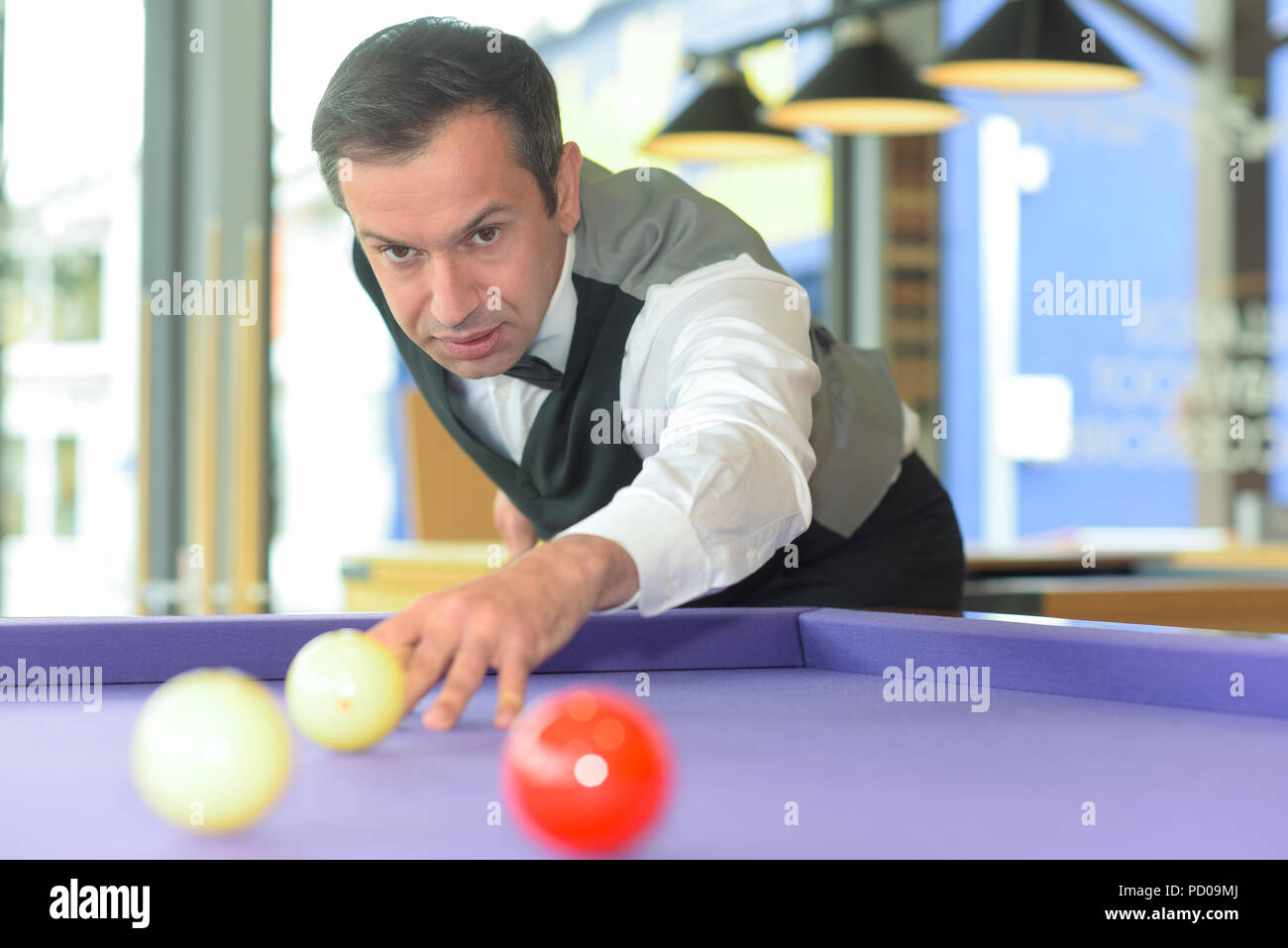 man playing billiard in a pool hall Stock Photo - Alamy