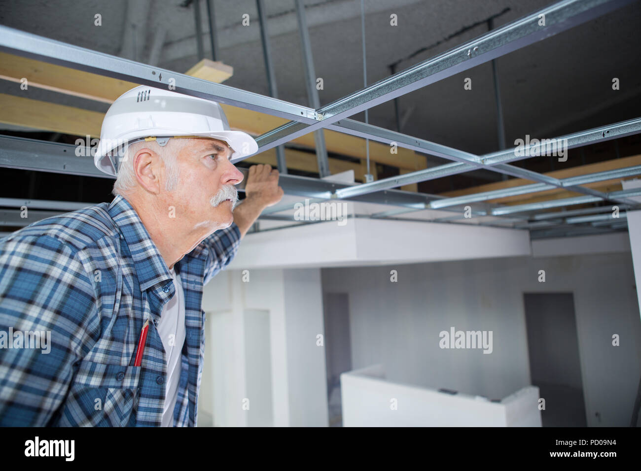 senior male checking ceiling Stock Photo - Alamy
