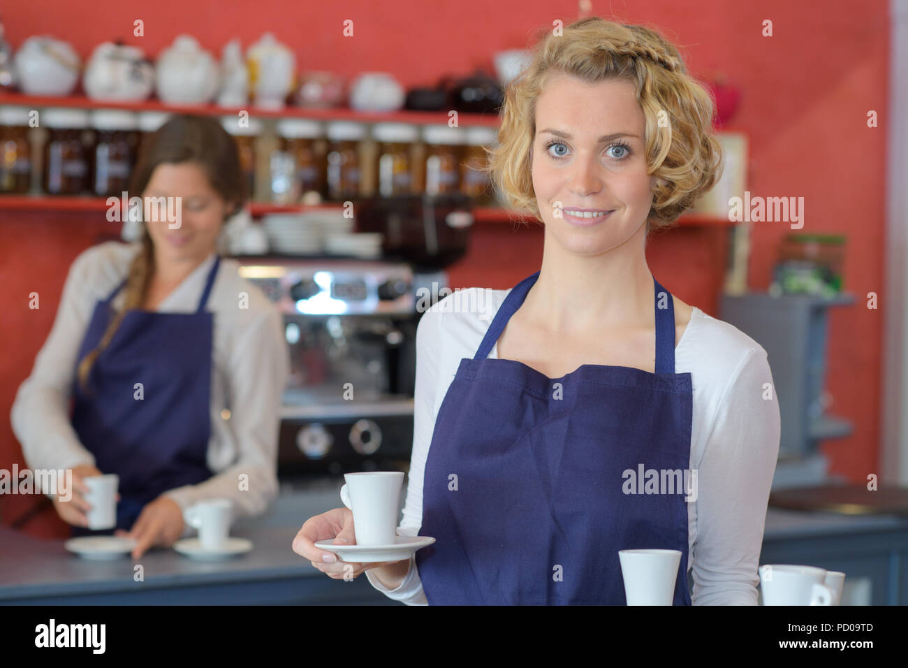 waitress a waiter working at cafe bar restaurant Stock Photo - Alamy
