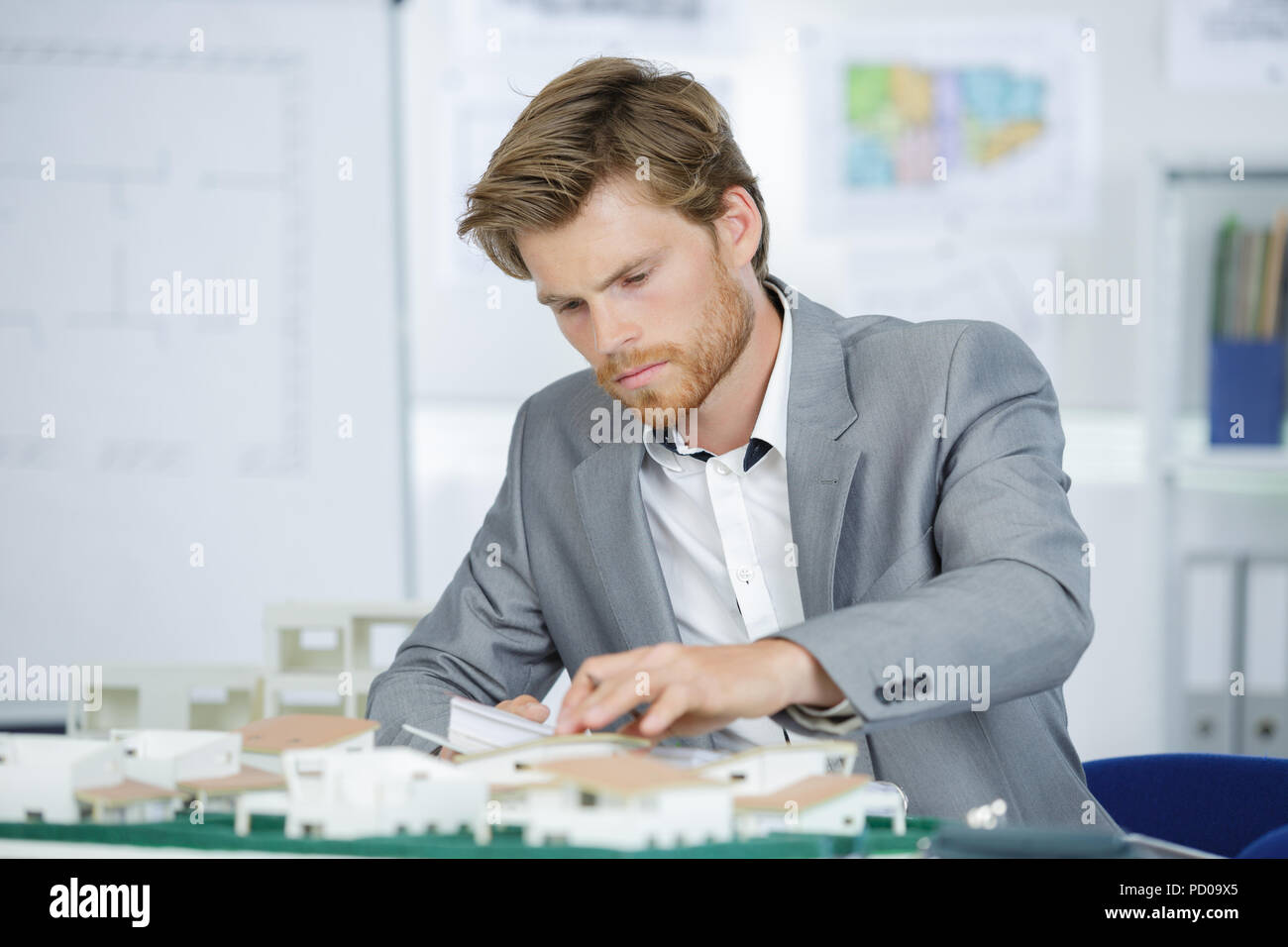 architect working on model Stock Photo - Alamy
