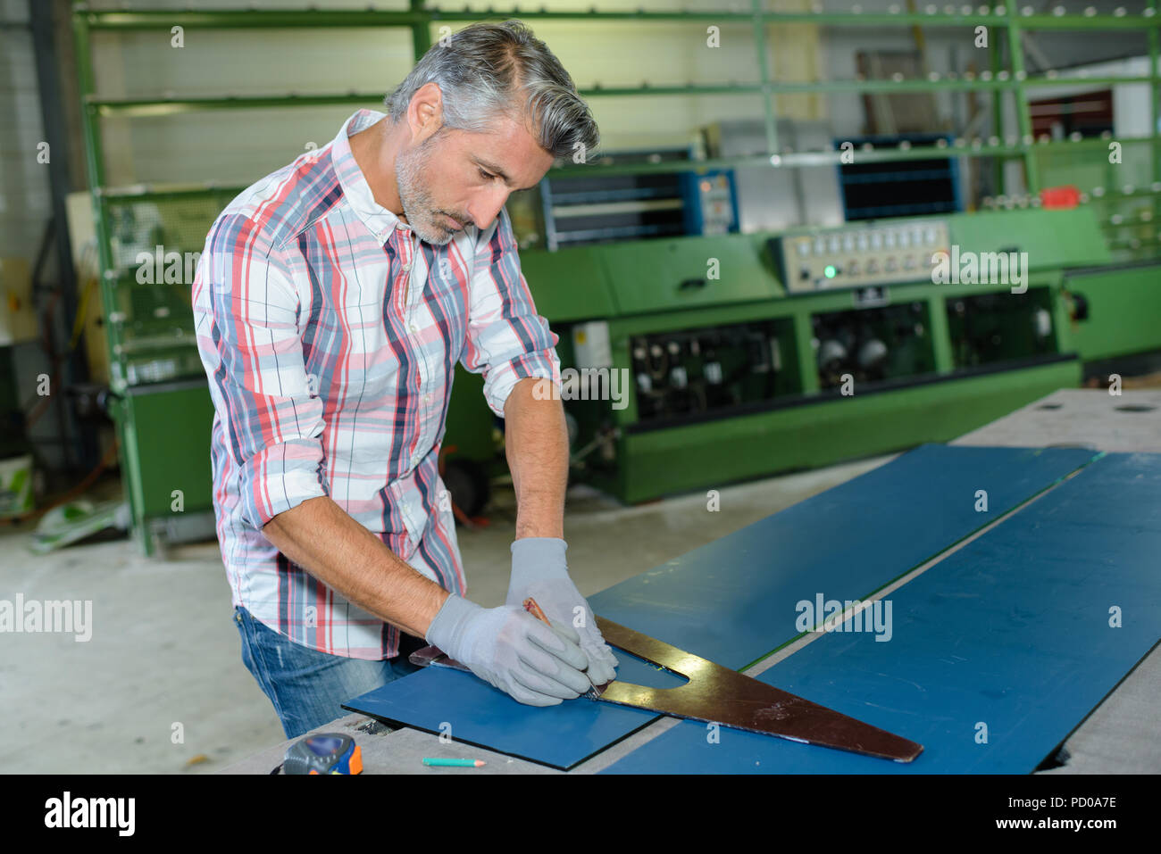 carpenter works with wood on his workspace Stock Photo - Alamy