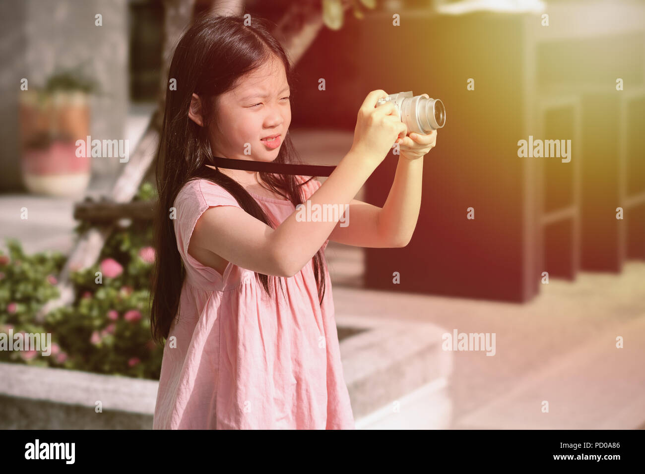 Asian child taking photo using digital camera Stock Photo - Alamy