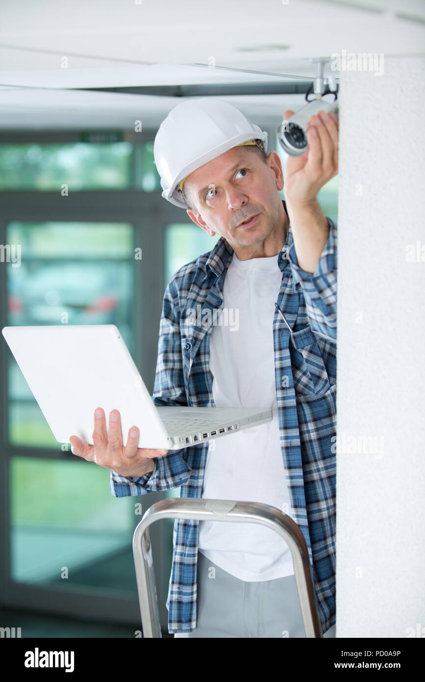 professional cctv technician working Stock Photo - Alamy