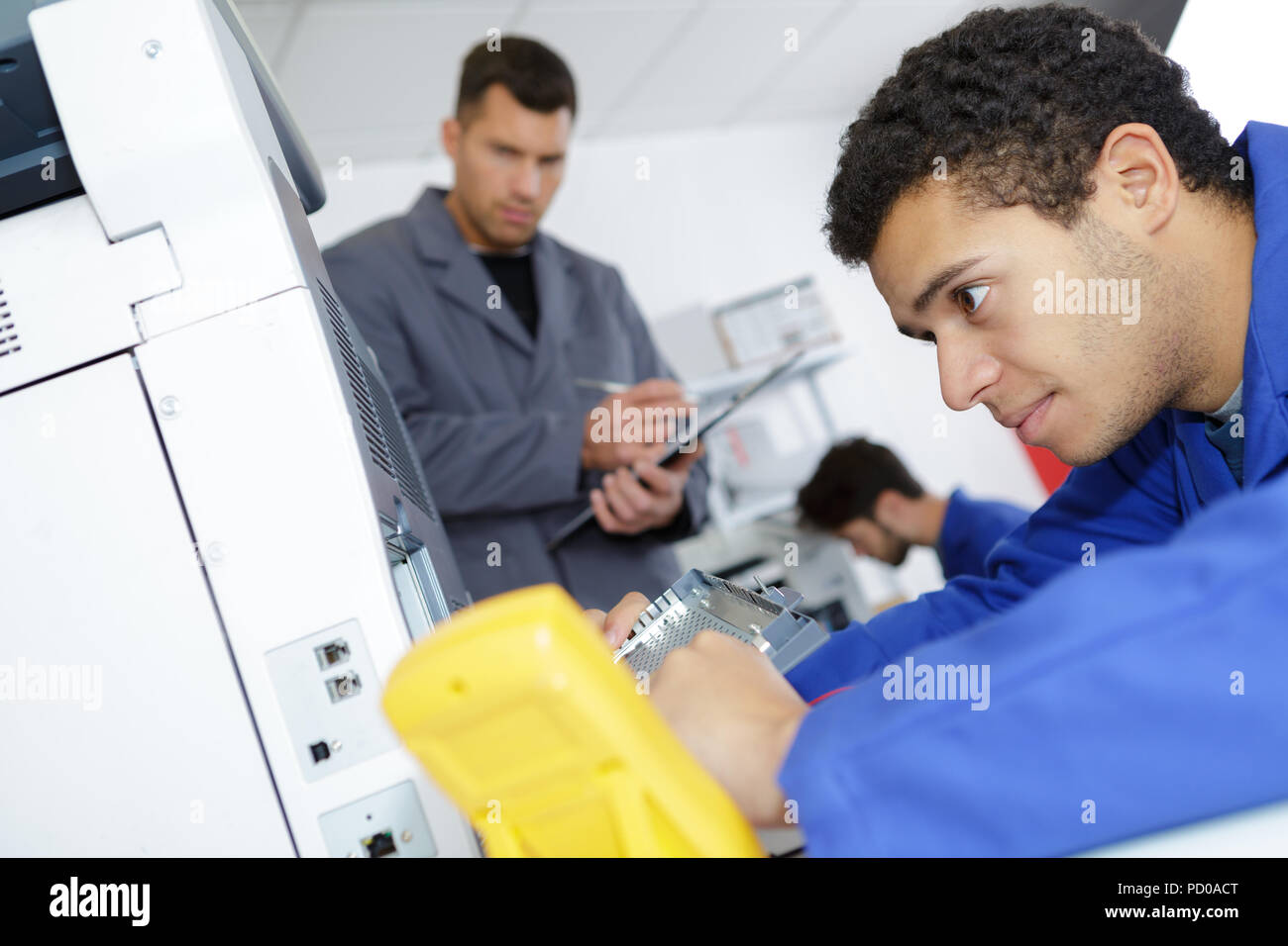man calibrating pinter Stock Photo - Alamy