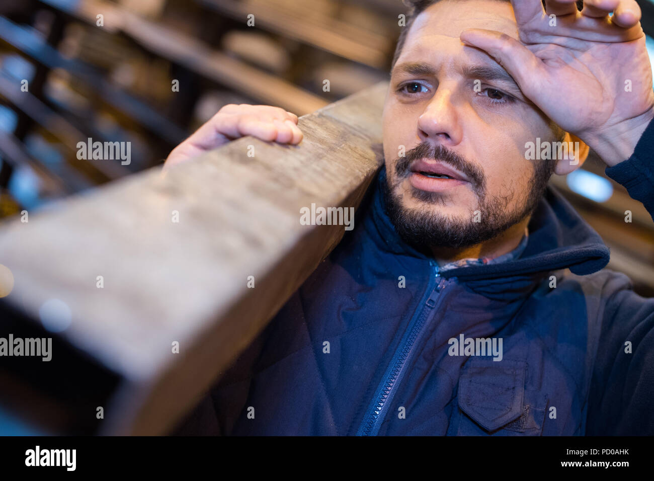 Man carrying metal beam hi-res stock photography and images - Alamy