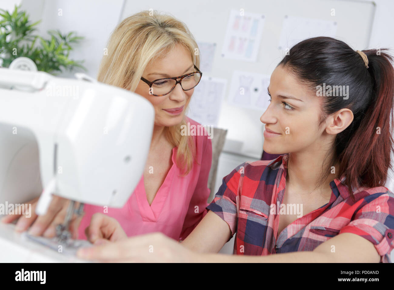 girls and sewing machine Stock Photo - Alamy