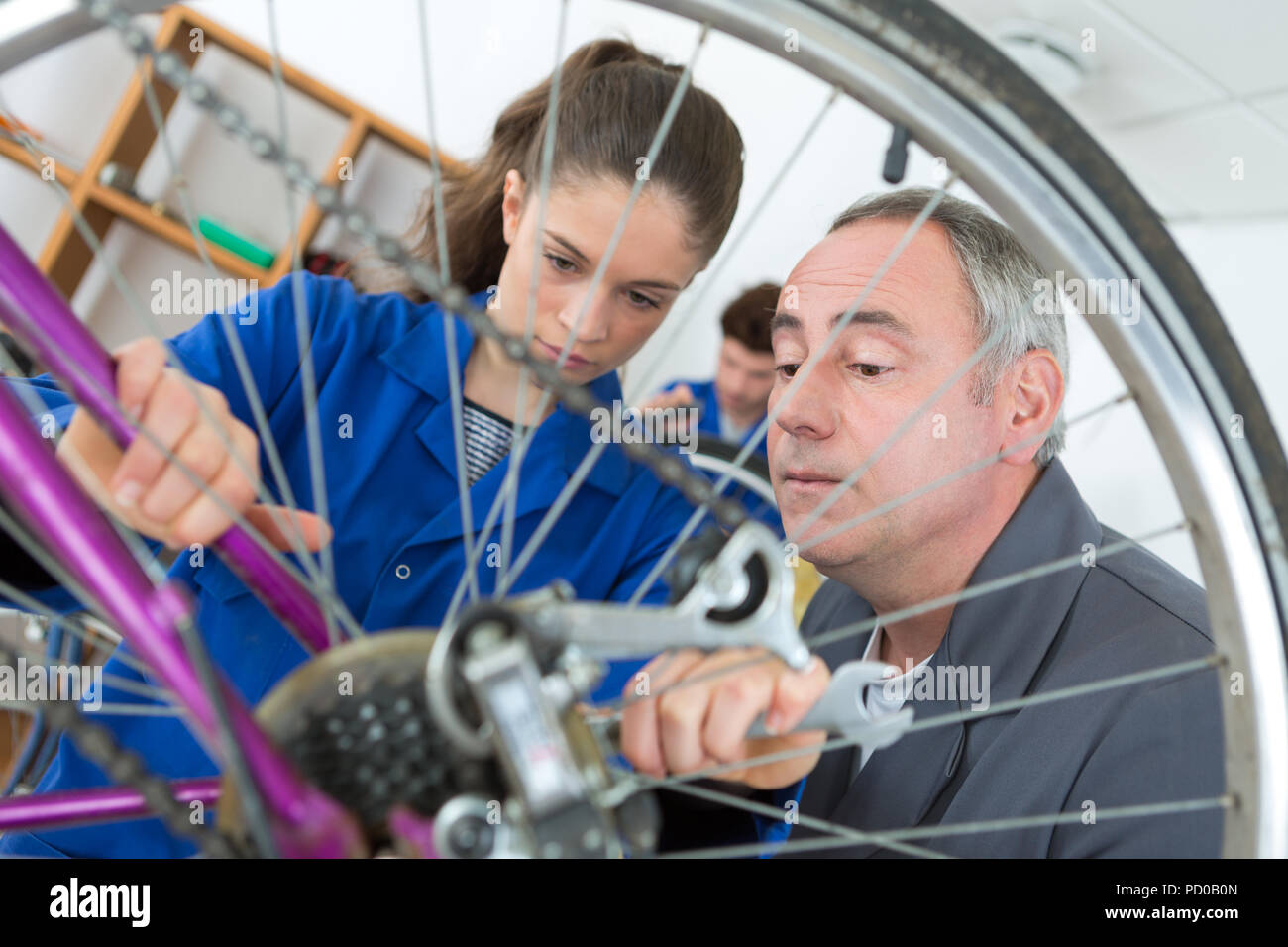 bike technician and her teacher Stock Photo - Alamy