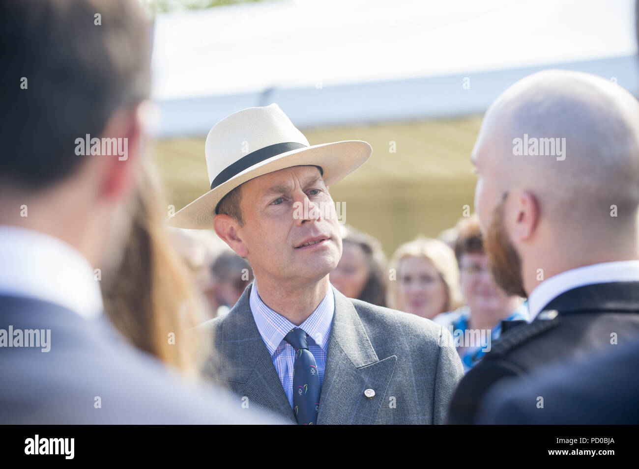Prince Edward, Earl of Wessex shields himself from the heat under a hat ...