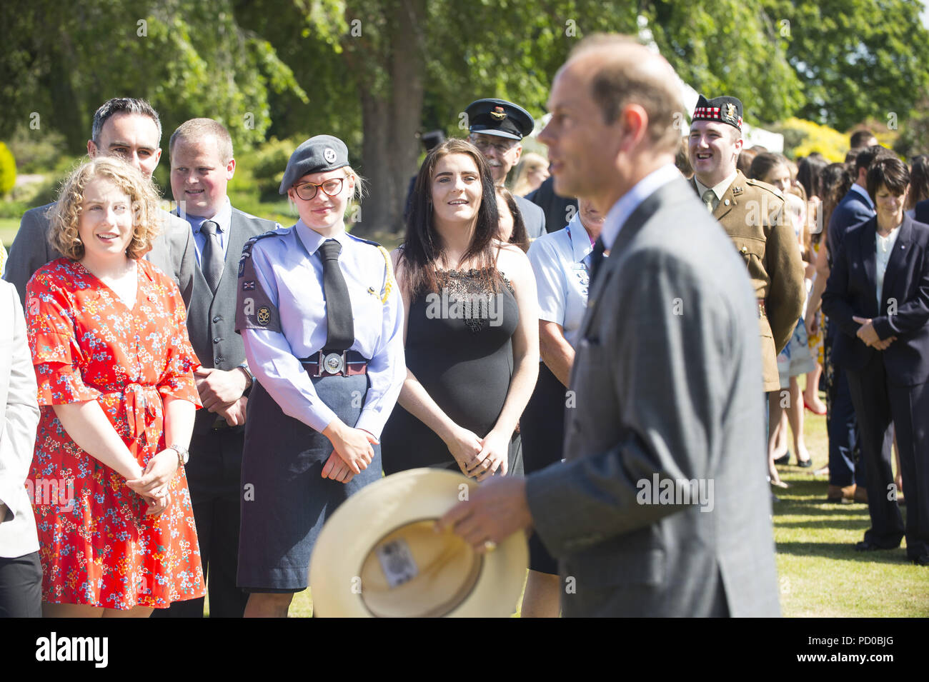 Prince Edward, Earl of Wessex shields himself from the heat under a hat ...