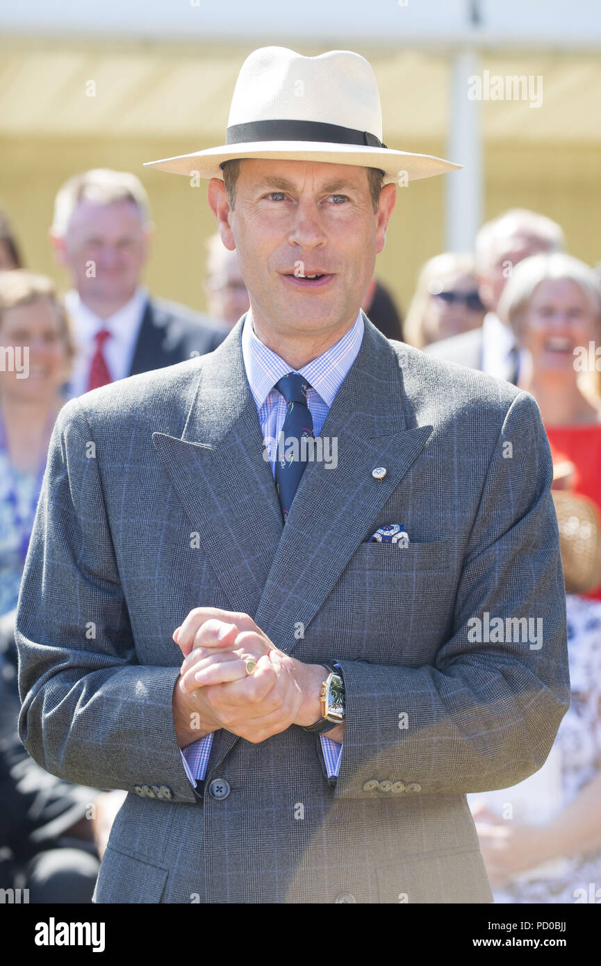 Prince Edward, Earl of Wessex shields himself from the heat under a hat ...