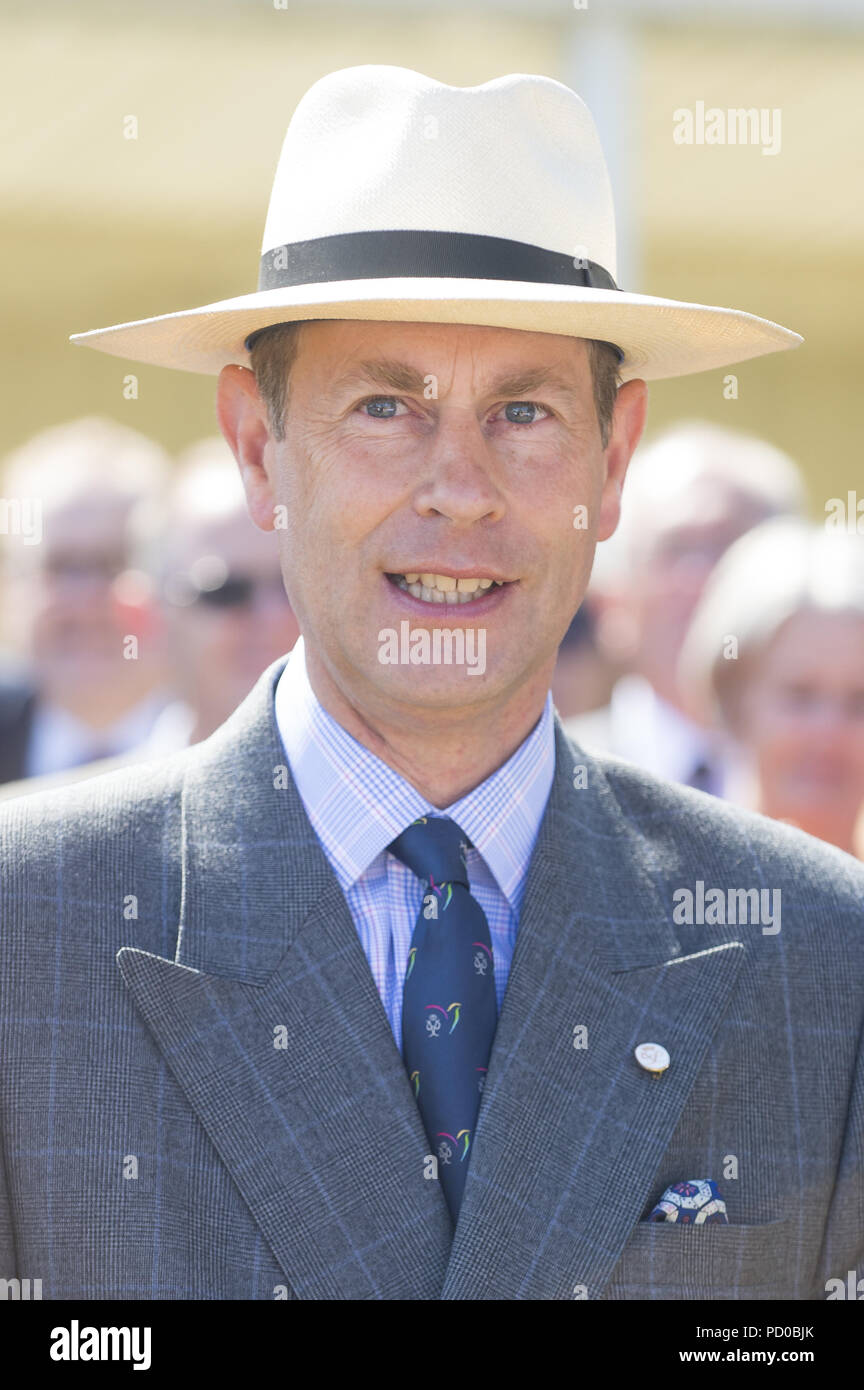 Prince Edward, Earl of Wessex shields himself from the heat under a hat ...
