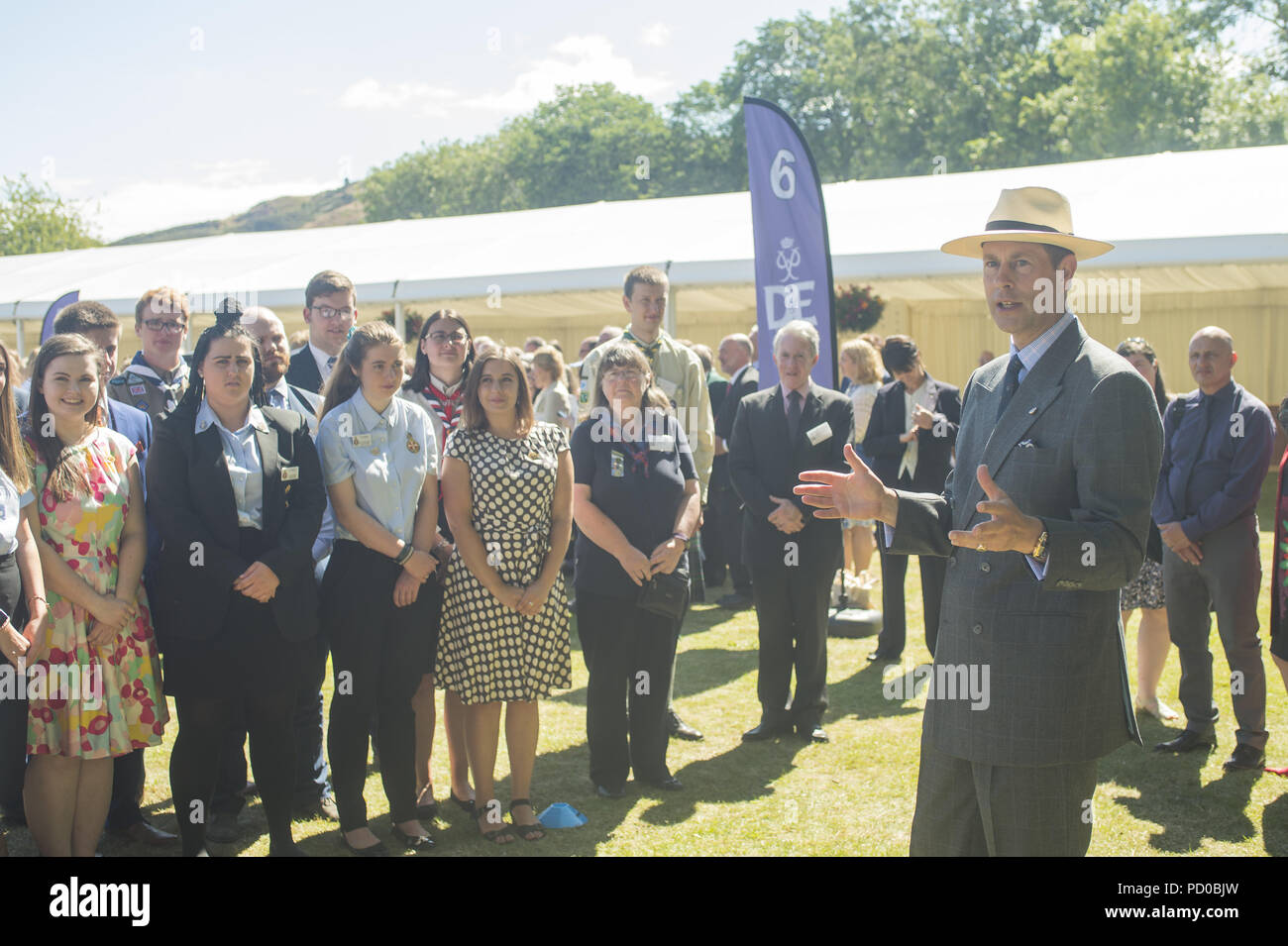 Prince Edward, Earl of Wessex shields himself from the heat under a hat ...
