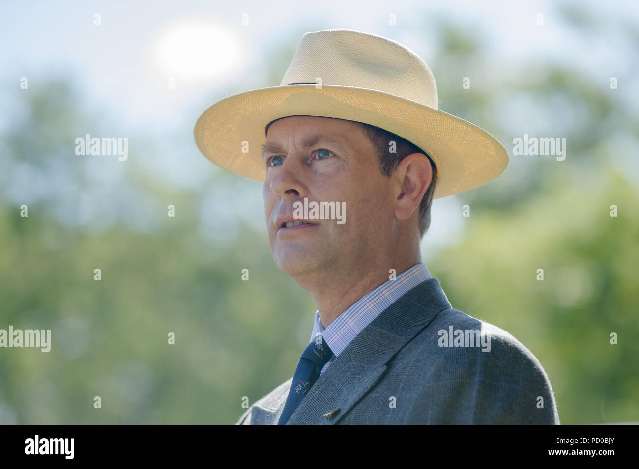 Prince Edward, Earl of Wessex shields himself from the heat under a hat ...