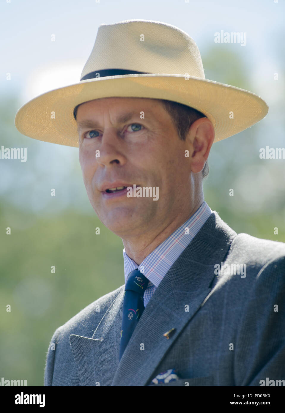 Prince Edward, Earl of Wessex shields himself from the heat under a hat ...