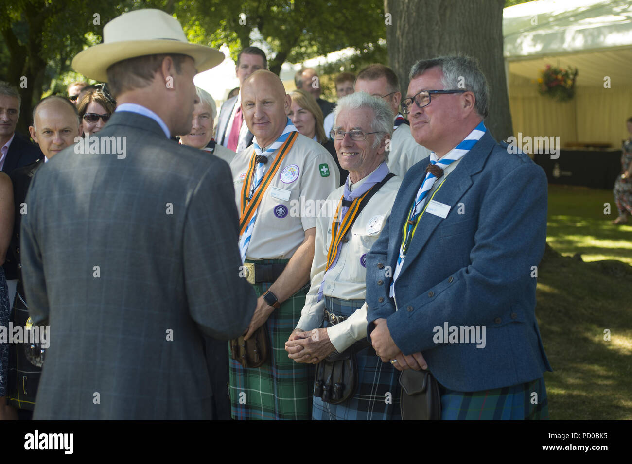 Prince Edward, Earl of Wessex shields himself from the heat under a hat ...
