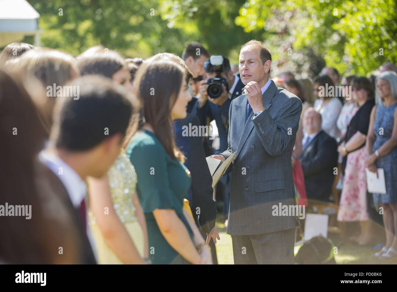 Prince Edward, Earl of Wessex shields himself from the heat under a hat ...