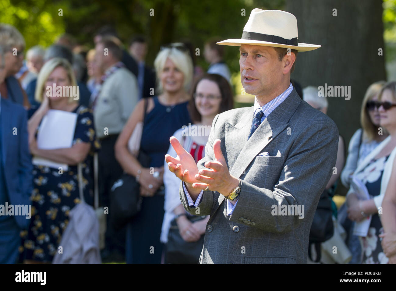 Prince Edward, Earl of Wessex shields himself from the heat under a hat ...