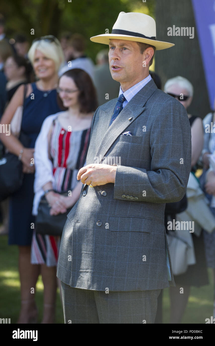 Prince Edward, Earl of Wessex shields himself from the heat under a hat ...