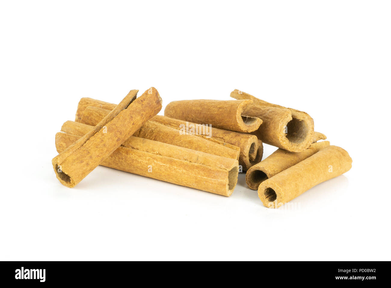 Lot of whole dry brown cinnamon stick isolated on white background ...