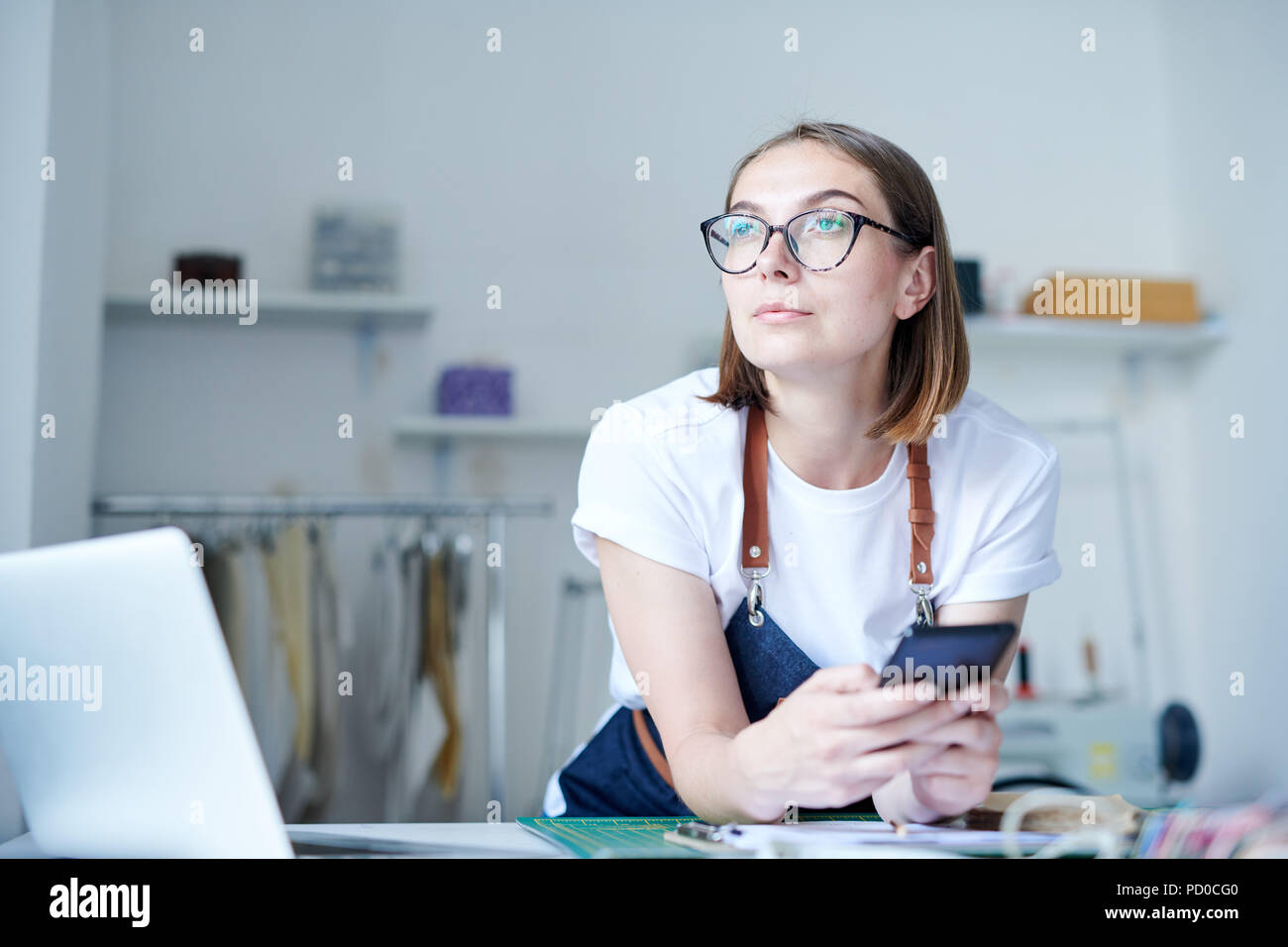 Tailor standing at workshop Stock Photo - Alamy