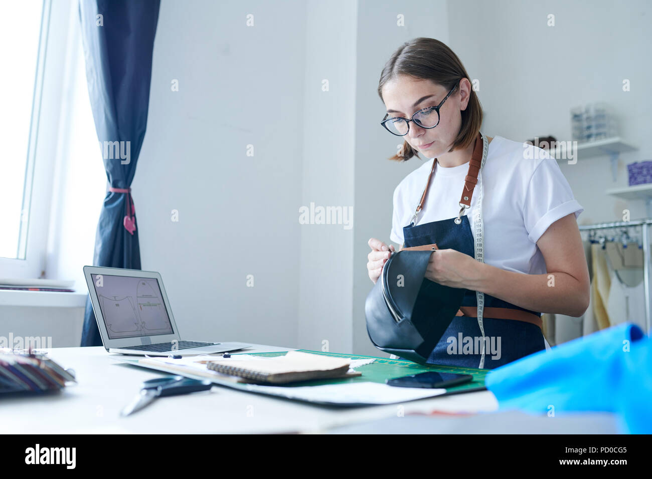 Female tanner creating new product Stock Photo - Alamy