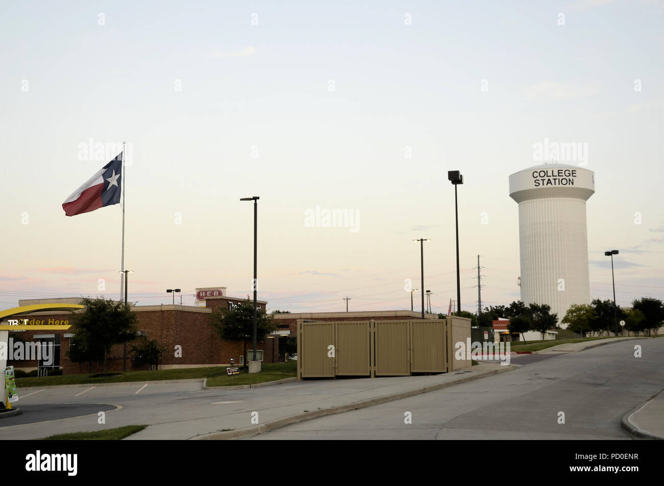 Texas flag waving in the wind with a water tower deposit reading ...