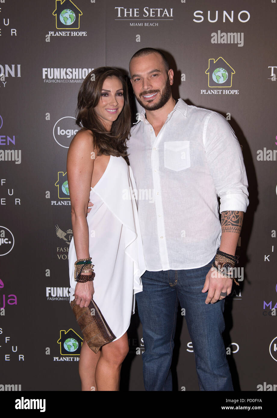 MIAMI BEACH, FL - NOVEMBER 6: Katrina Campins, Mustafa Hassan Mustafa ...