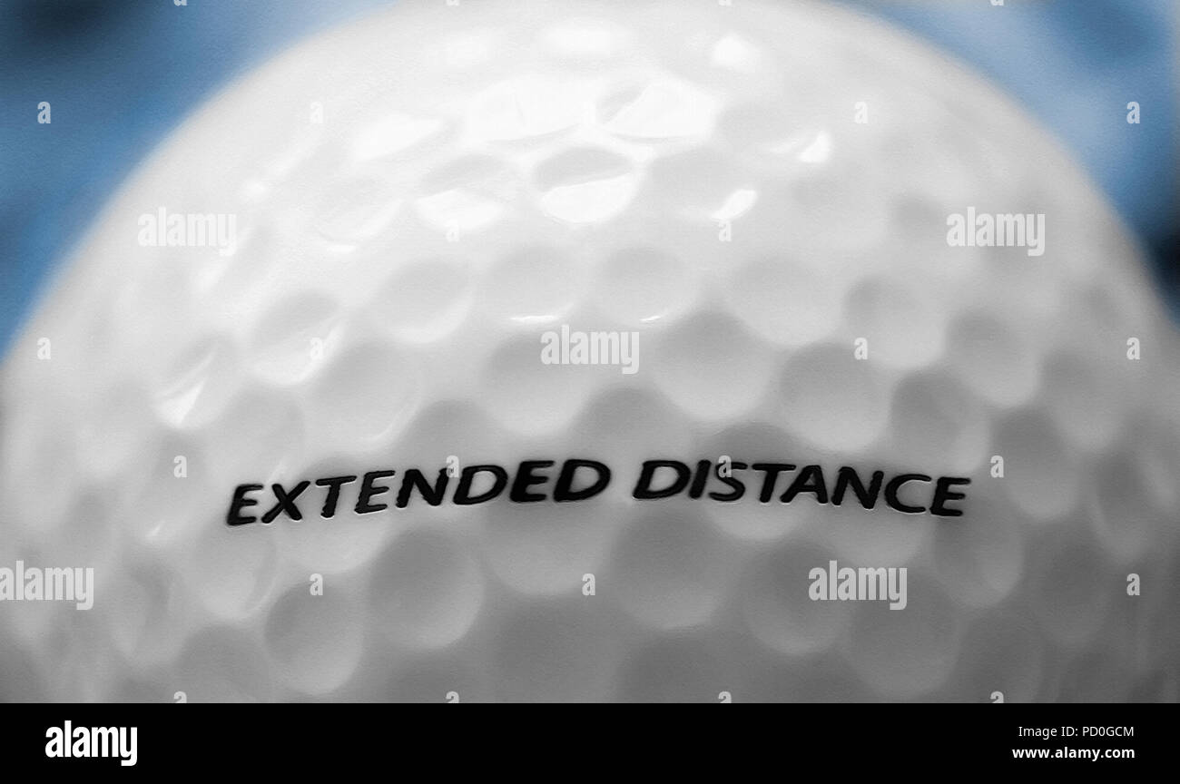Macro image of a shiny new golf ball with the words "Extended Distance ...