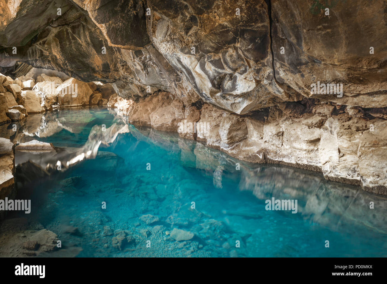 Geothermal Grjotagja lava cave near Lake Myvatn in Iceland Stock Photo ...