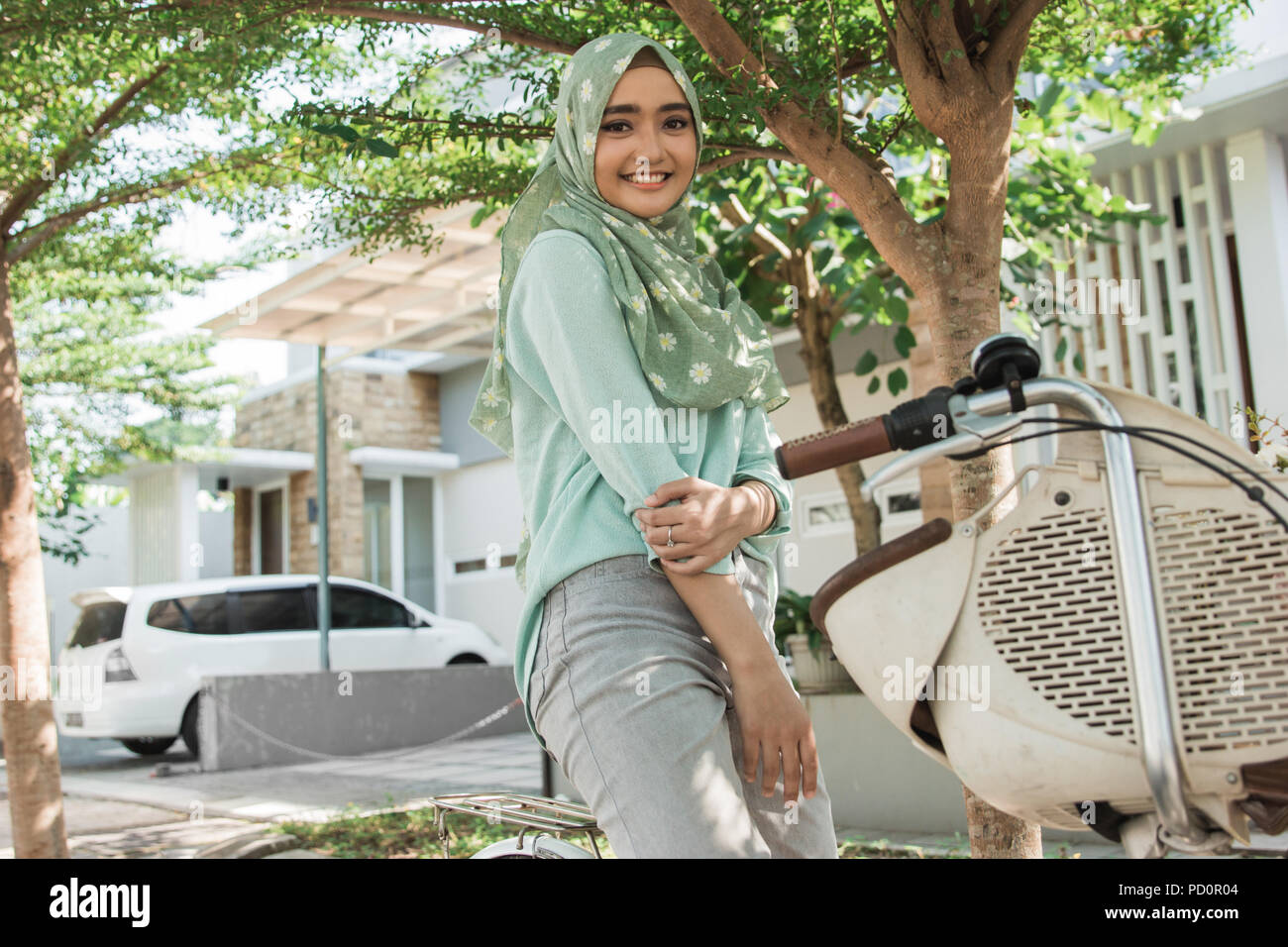 woman wearing hijab riding a bike Stock Photo - Alamy
