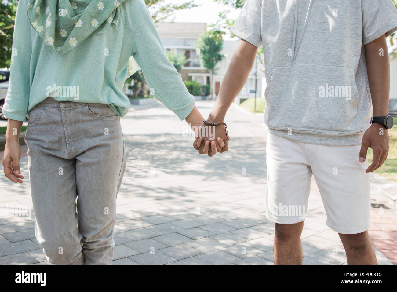 hands holding together Stock Photo - Alamy