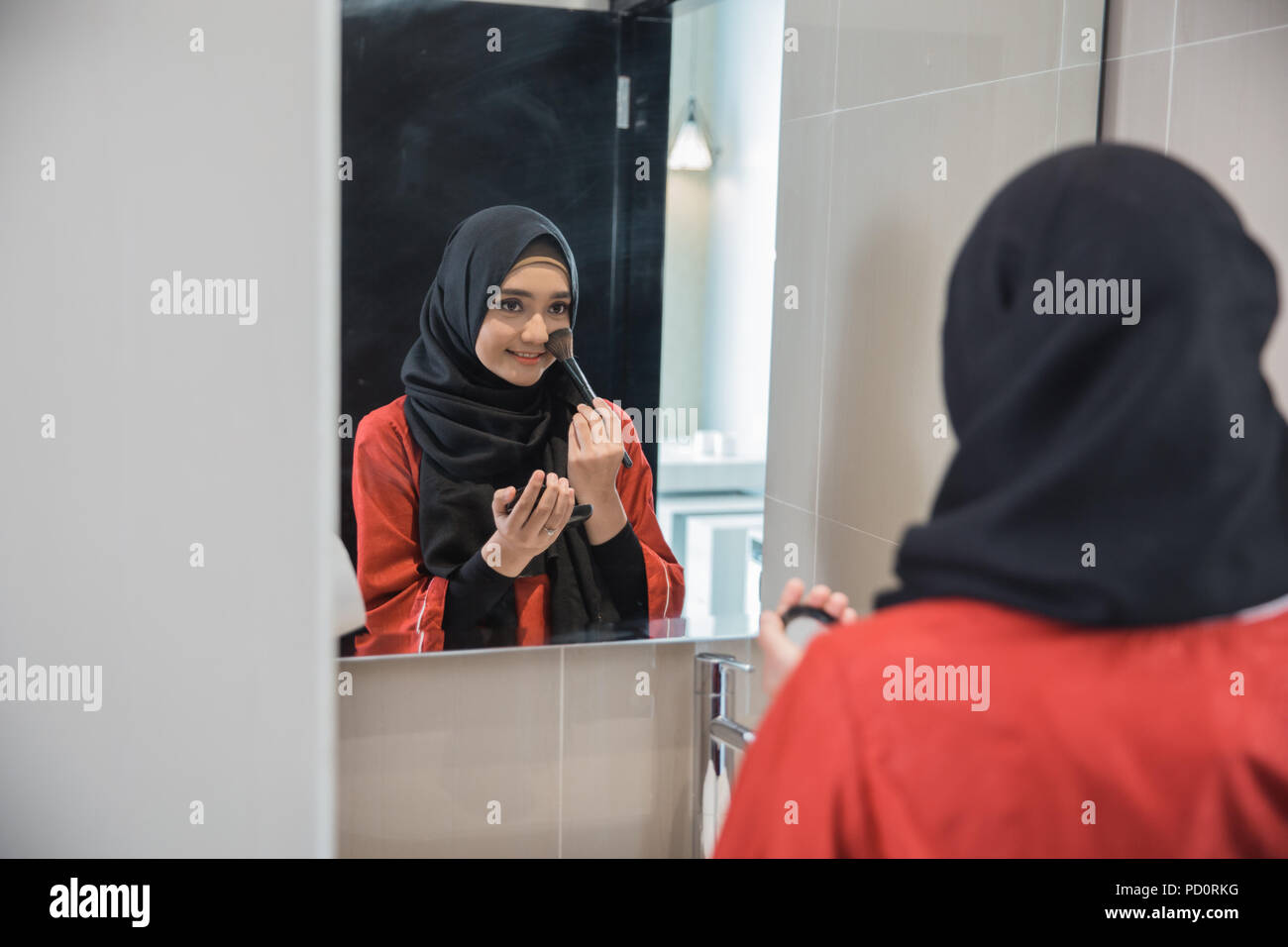 muslim woman taking care of her self Stock Photo - Alamy