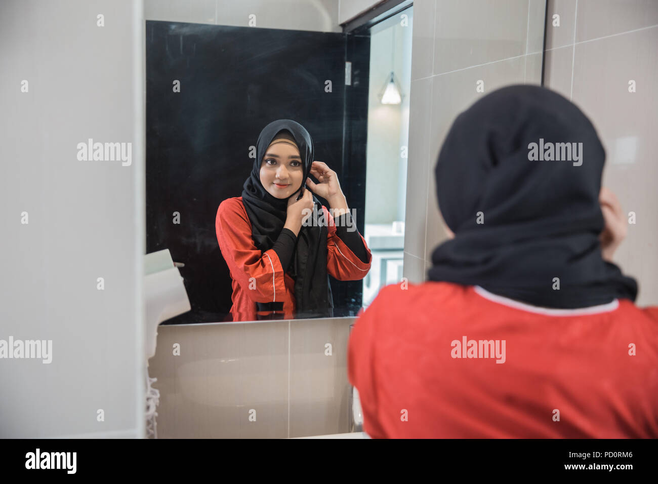 muslim woman taking care of her self Stock Photo - Alamy