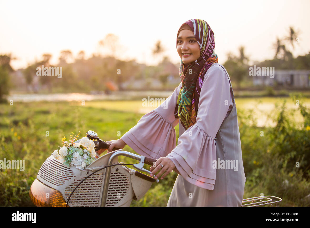 woman wearing hijab riding a bike Stock Photo - Alamy