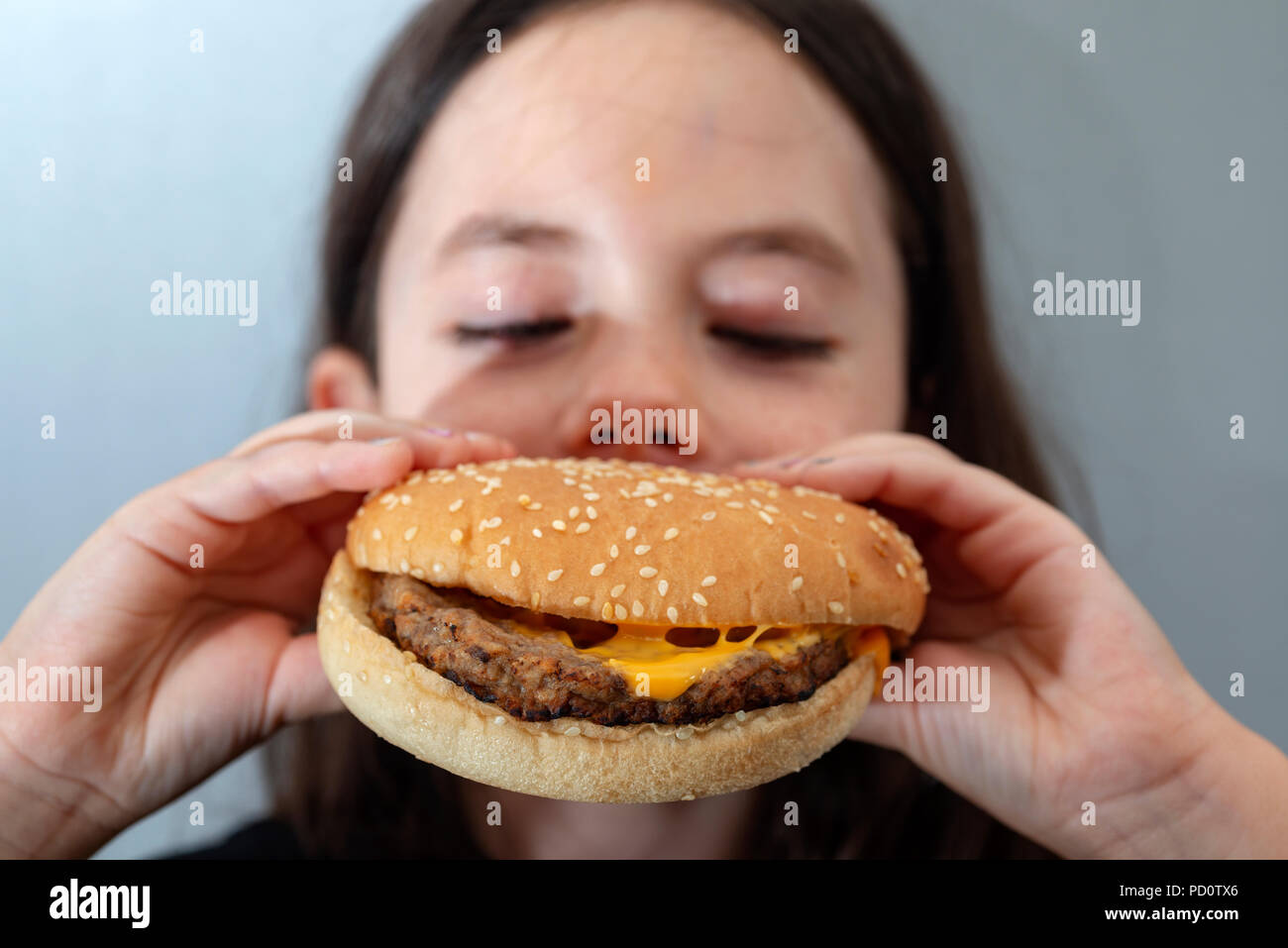 Cheese burger eating hi-res stock photography and images - Alamy