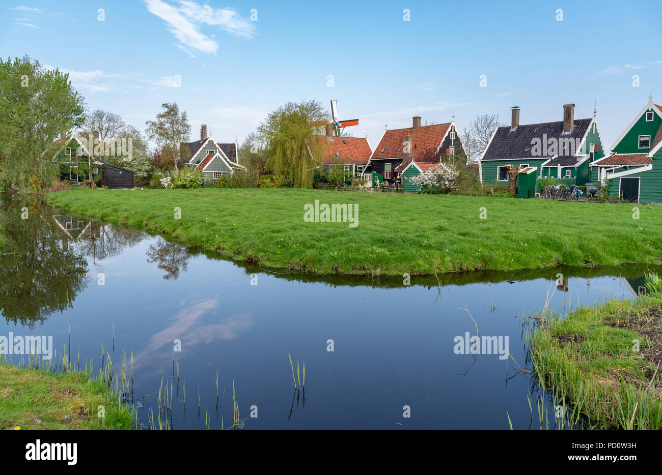 rural scenery of old houses and canal in Zaanse Schans, Netherlands ...