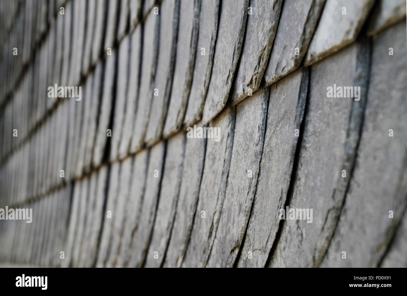 Details of black shale tiles on a house Stock Photo - Alamy