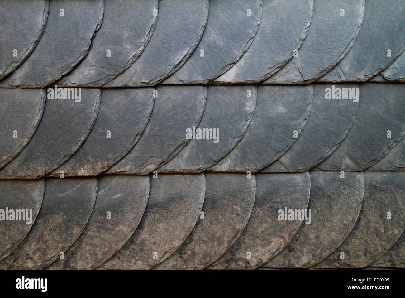 Details of black shale tiles on a house Stock Photo - Alamy