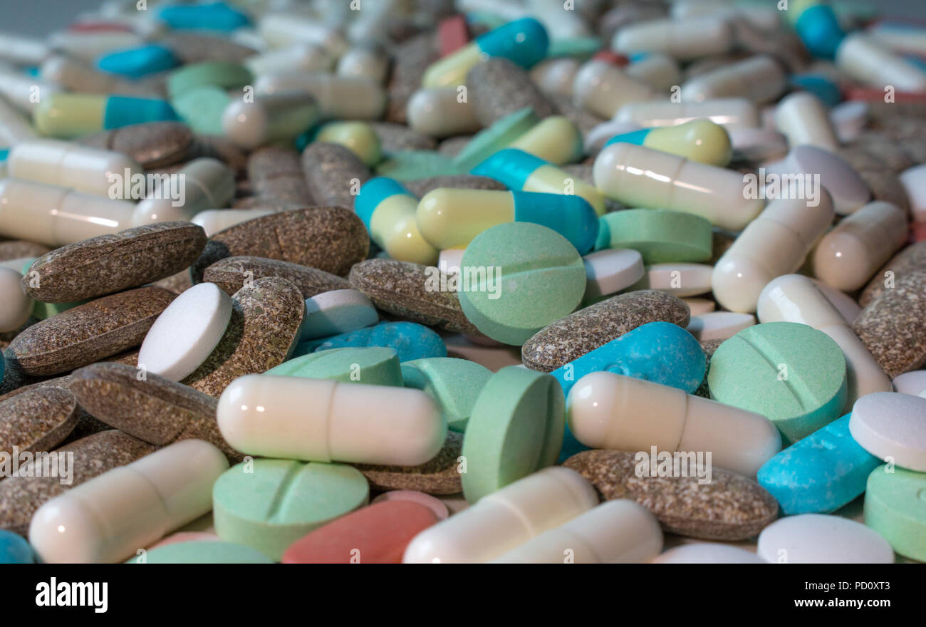 Colorful pills and tablets background frame Stock Photo - Alamy