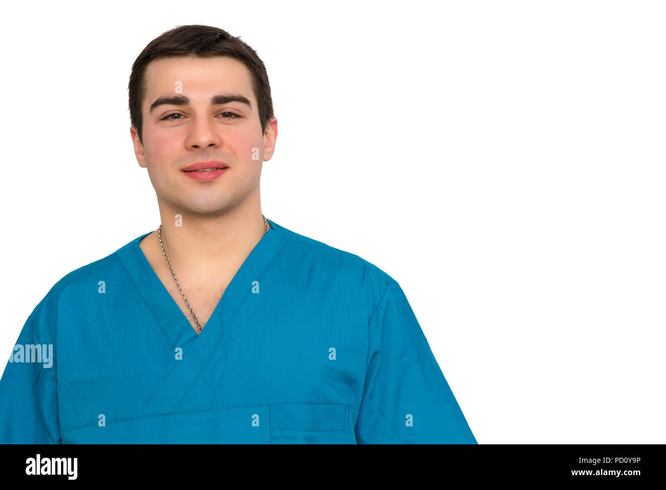 Portrait of young smiling male doctor wearing blue gown isolated ...