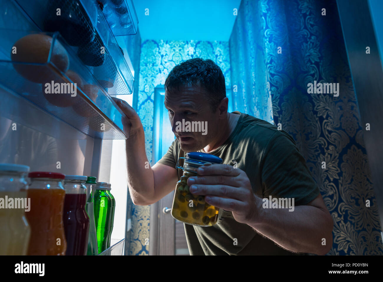 Raiding fridge man hi-res stock photography and images - Alamy