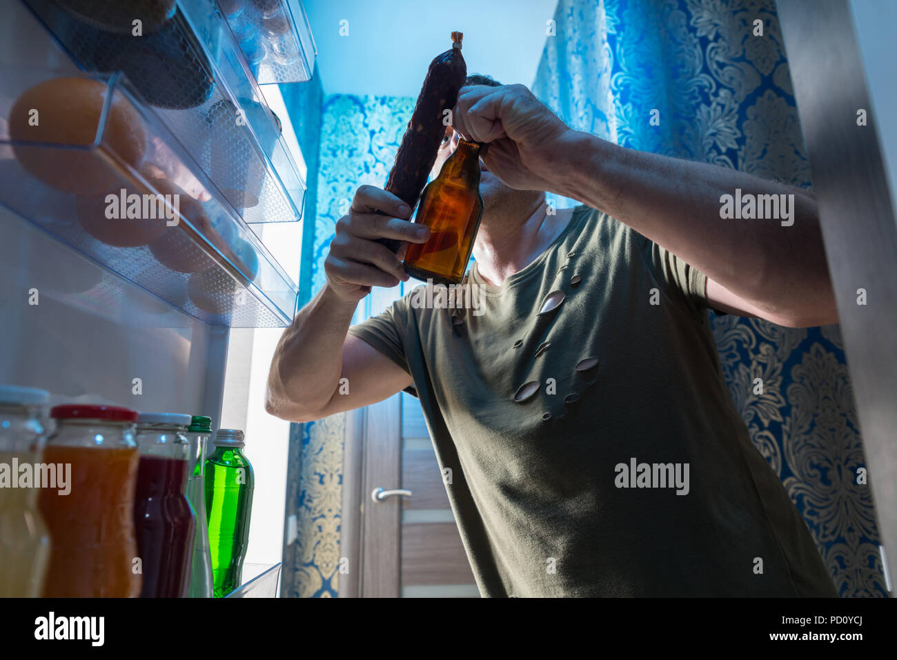 Grabbing food from fridge hi-res stock photography and images - Alamy