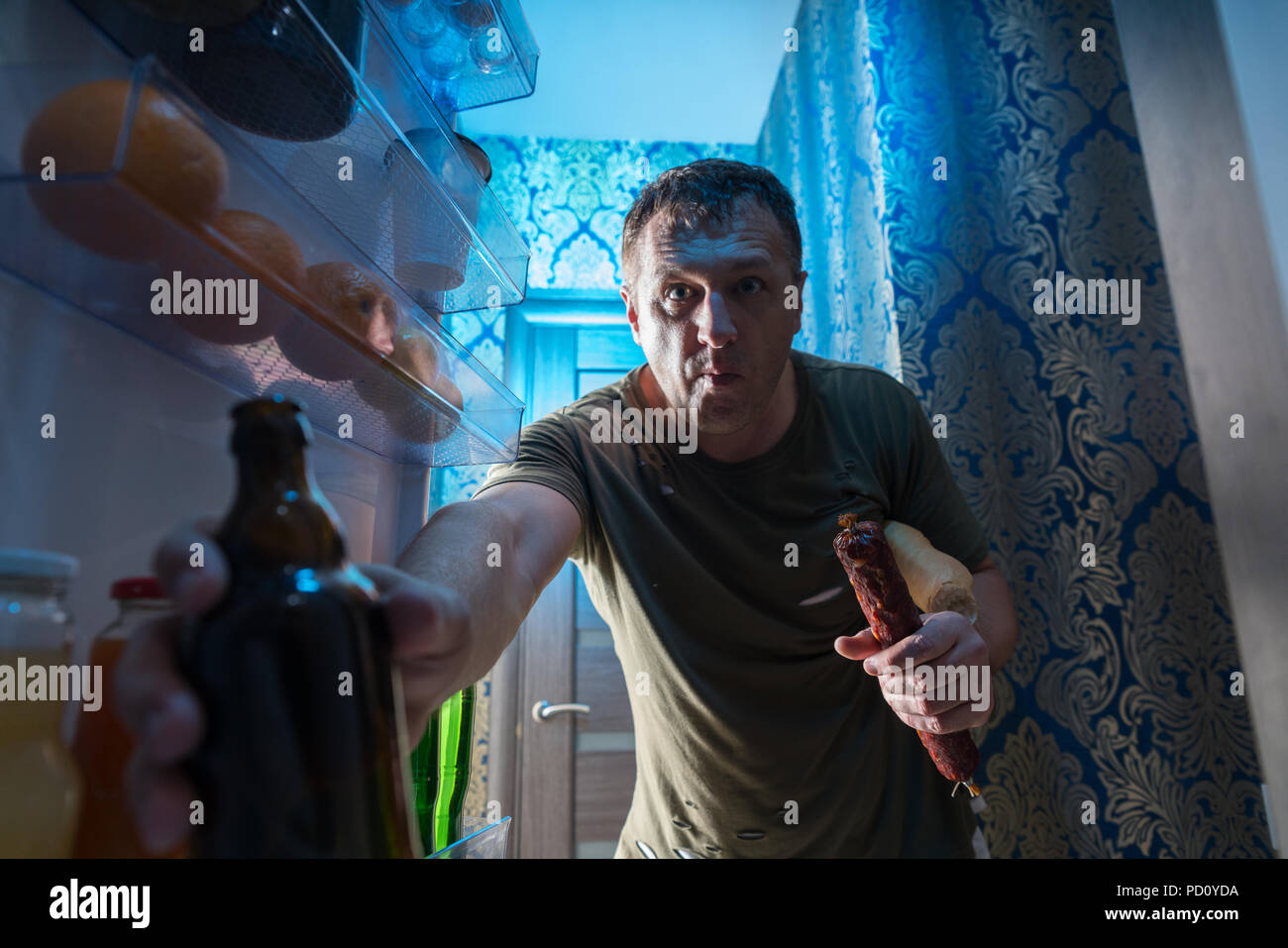 Grabbing food from fridge hi-res stock photography and images - Alamy