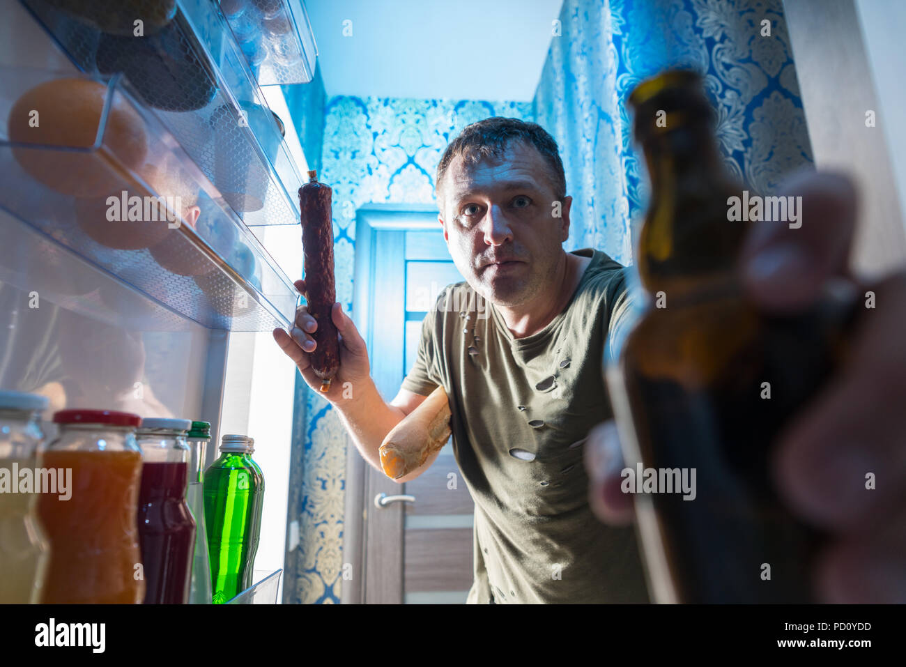 Grabbing food from fridge hi-res stock photography and images - Alamy
