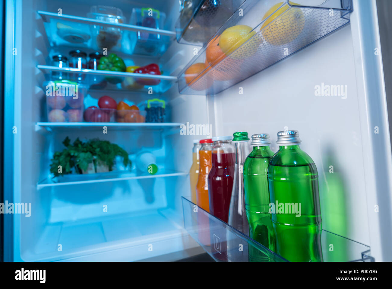 Fully stocked fridge with fresh fruit, vegetables and assorted ...