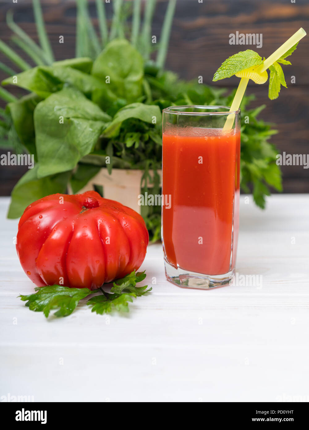 Healthy fresh tomato smoothie or cocktail blended with fresh herbs and ...