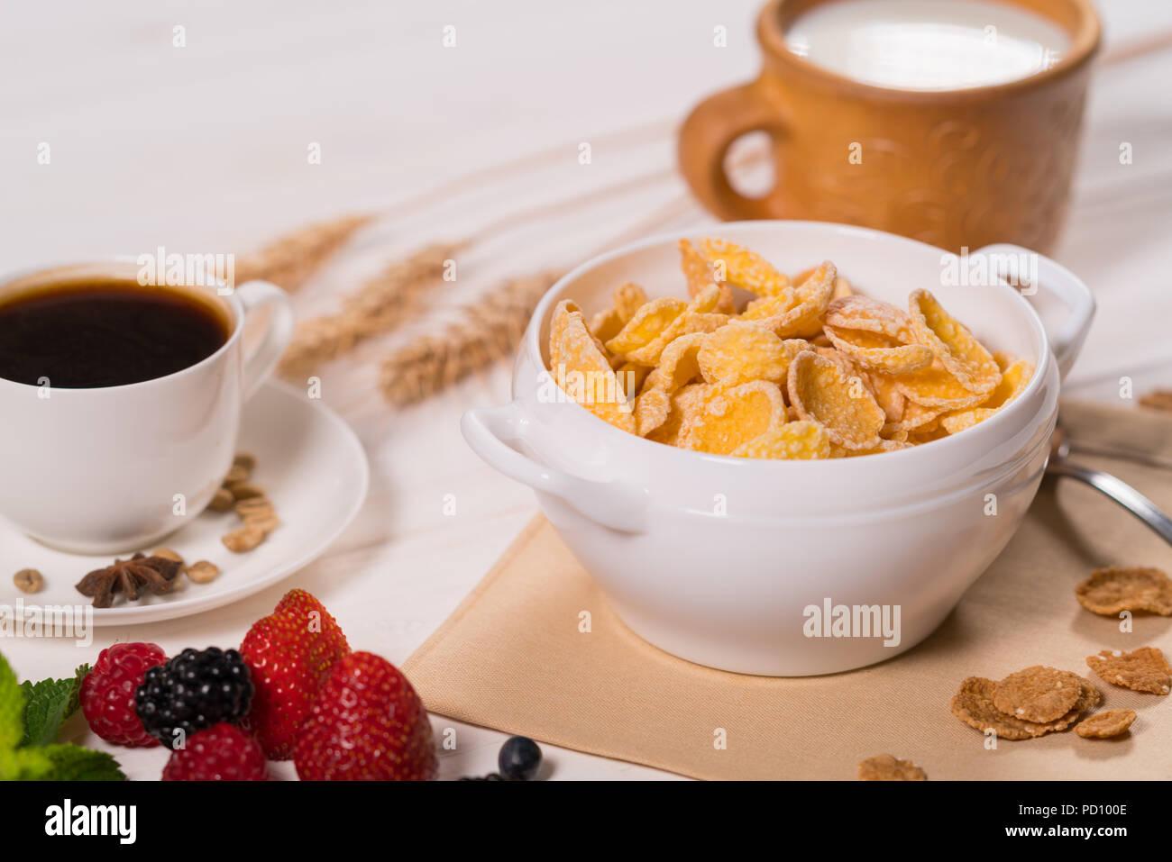Bowl of breakfast cereal with cup of coffee and fruits Stock Photo - Alamy