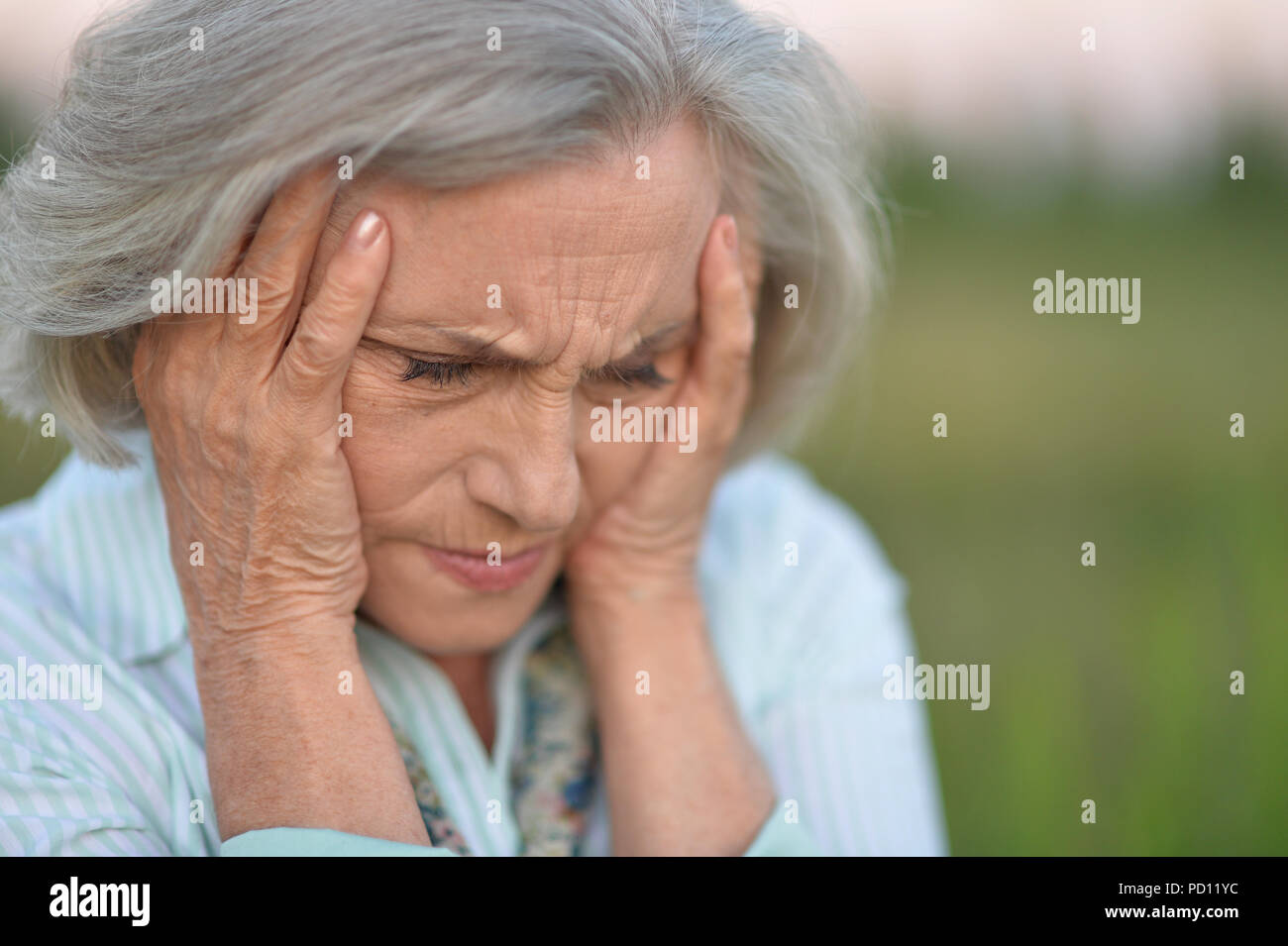 Portrait of sad senior woman Stock Photo - Alamy